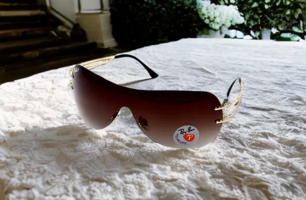 SwamiRaj EyeWorld Golden & Brown Ray-Ban – Rimless One-Piece Sunglasses ...